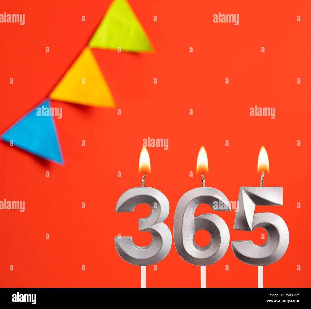 Three candles forming the number 365 - Red background Stock Photo - Alamy