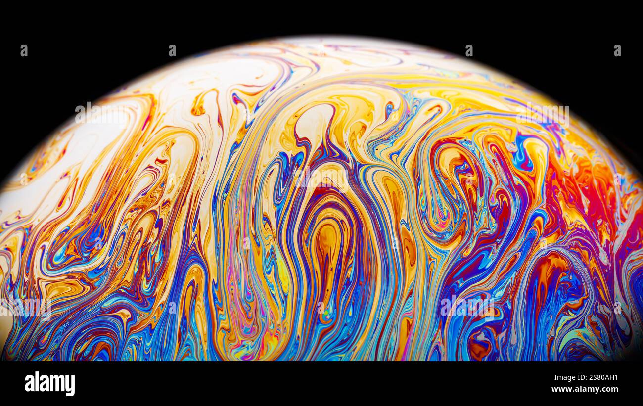 Multi colored soap bubble showing different specturm of light caused by ...