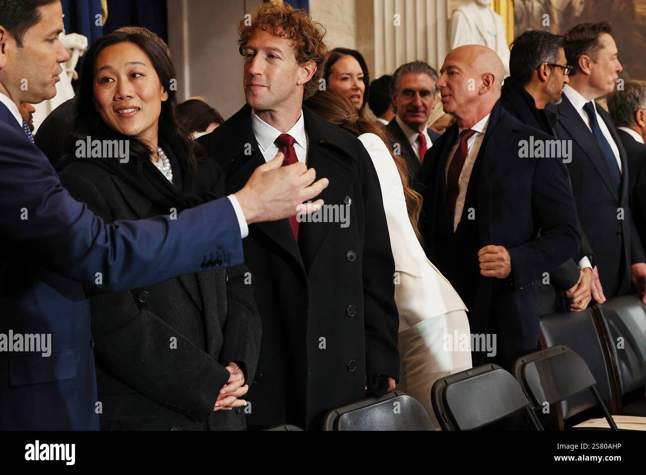 Meta CEO Mark Zuckerberg, center, and his wife Priscilla Chan, left ...