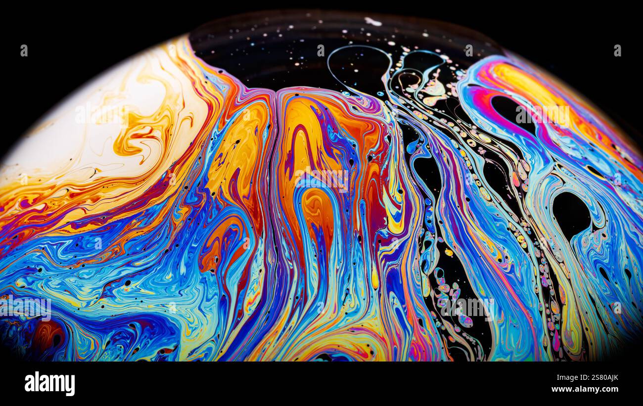 Multi colored soap bubble showing different specturm of light caused by ...