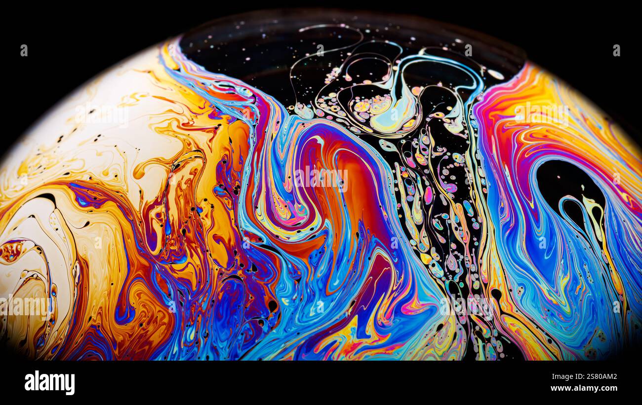 Multi colored soap bubble showing different specturm of light caused by ...