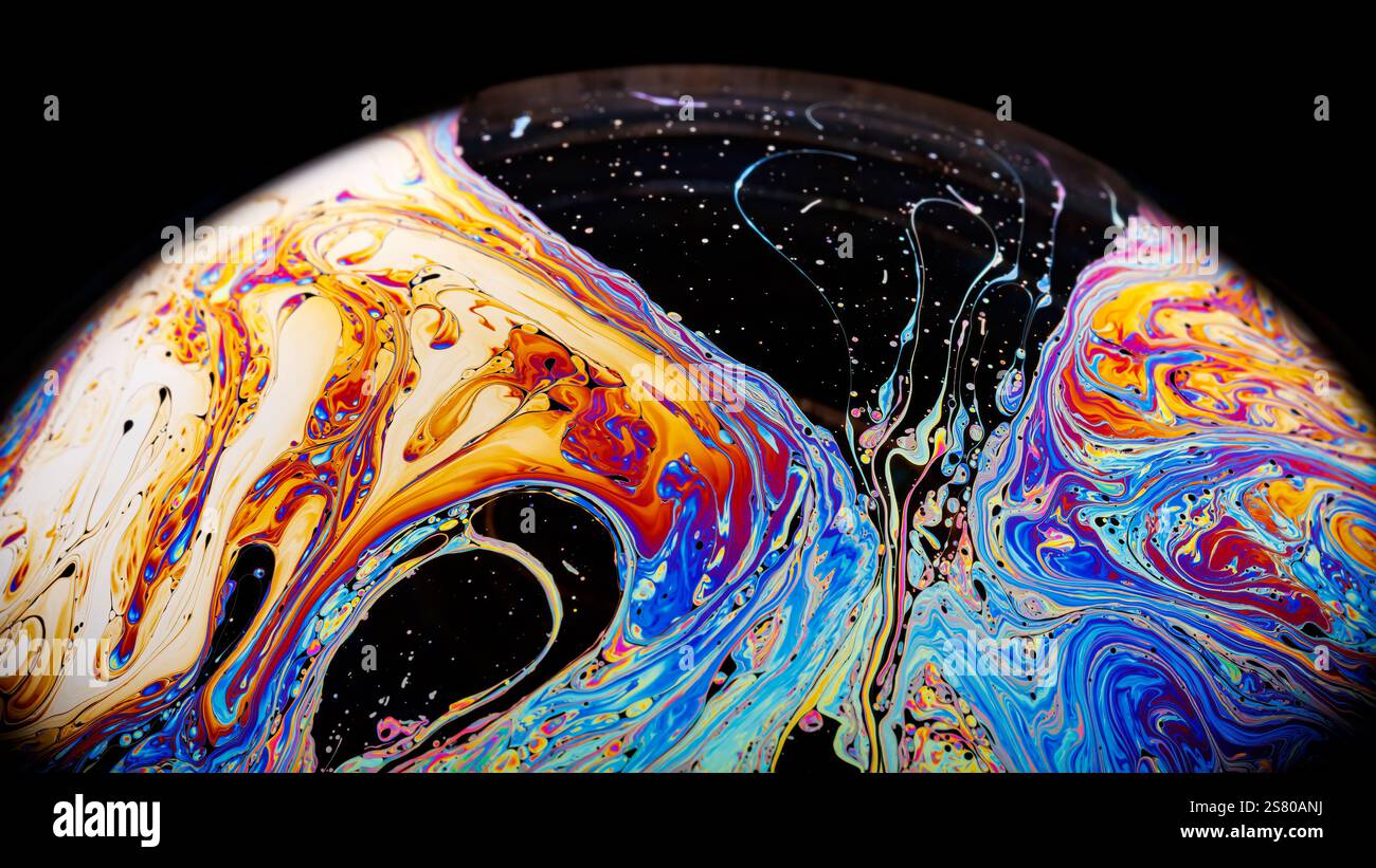 Multi colored soap bubble showing different specturm of light caused by ...