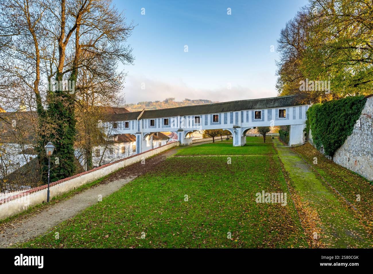 Covered bridge from Cesky Krumlov Castle leading into the park, arching over a narrow alley. The ...