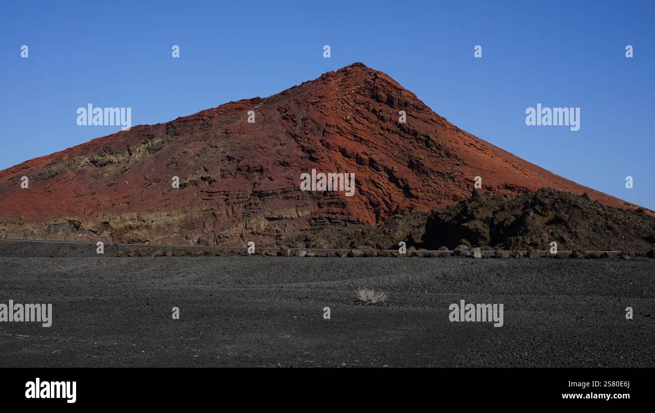 Sunbathing under the Bermeja volcano. Canary Islands Stock Photo - Alamy