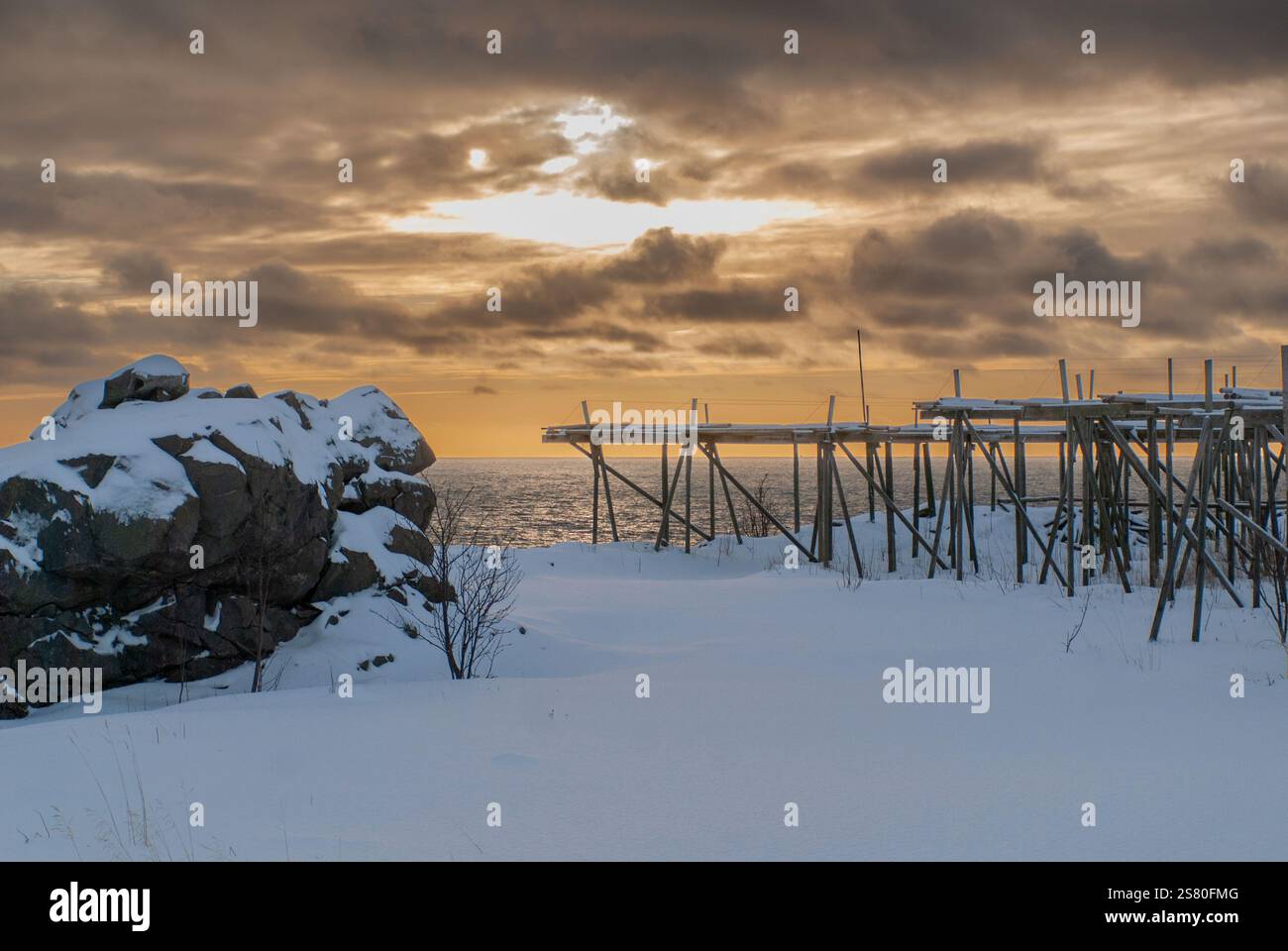 Norwegian winter landscape with rock,clouds and fish flake used for ...