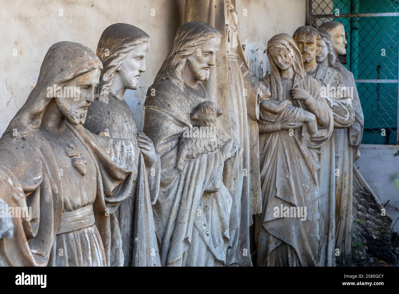 Statues of Jesus next to a section of the Saigon railway in Ho Chi Minh ...