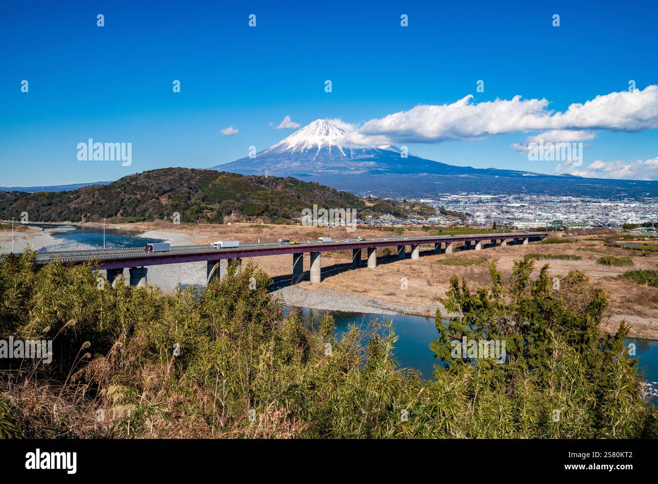 Car passing bridge with Mount Fuji in background, Shizuoka, Japan Stock ...