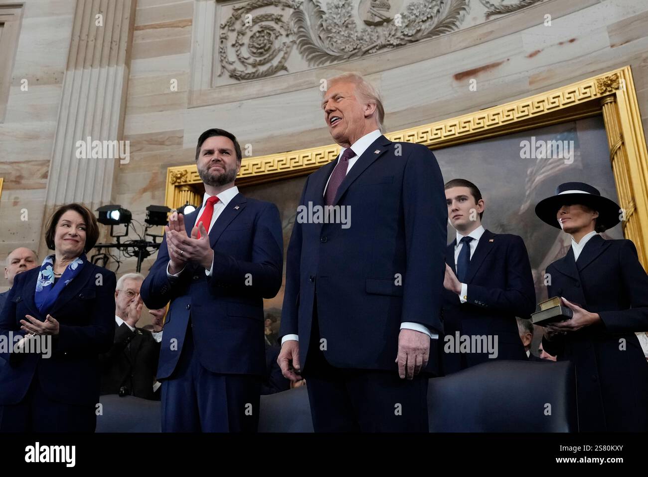 Donald Trump, right, and JD Vance, left, on stage before taking their ...
