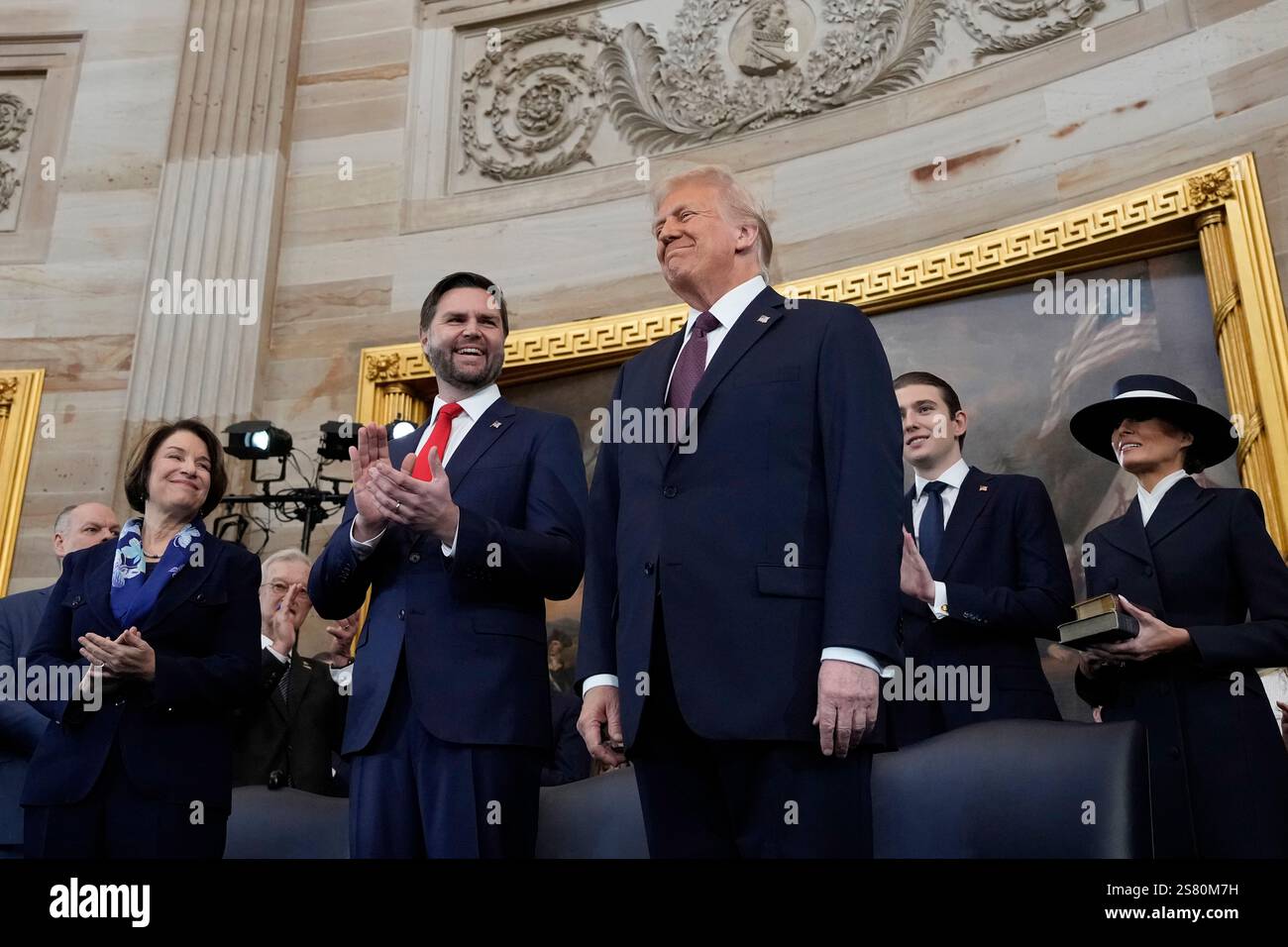 Donald Trump, right, and JD Vance, left, on stage before taking their ...