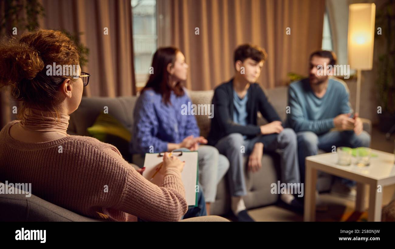 Focus of woman, psychologist making noise while family, parents and ...