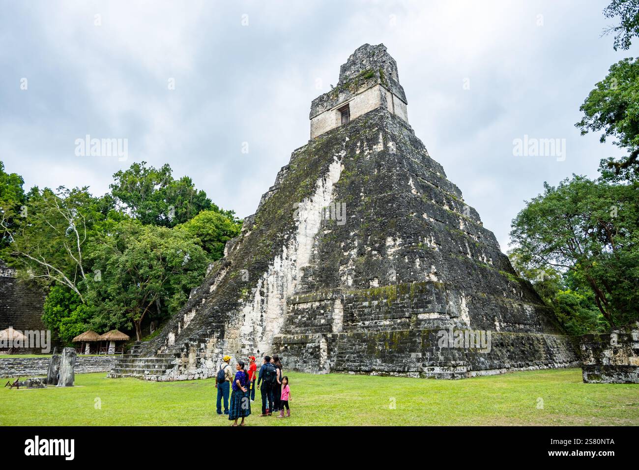 Visitors admire Templo del Gran Jaguar, Tikal National Park, Guatemala ...
