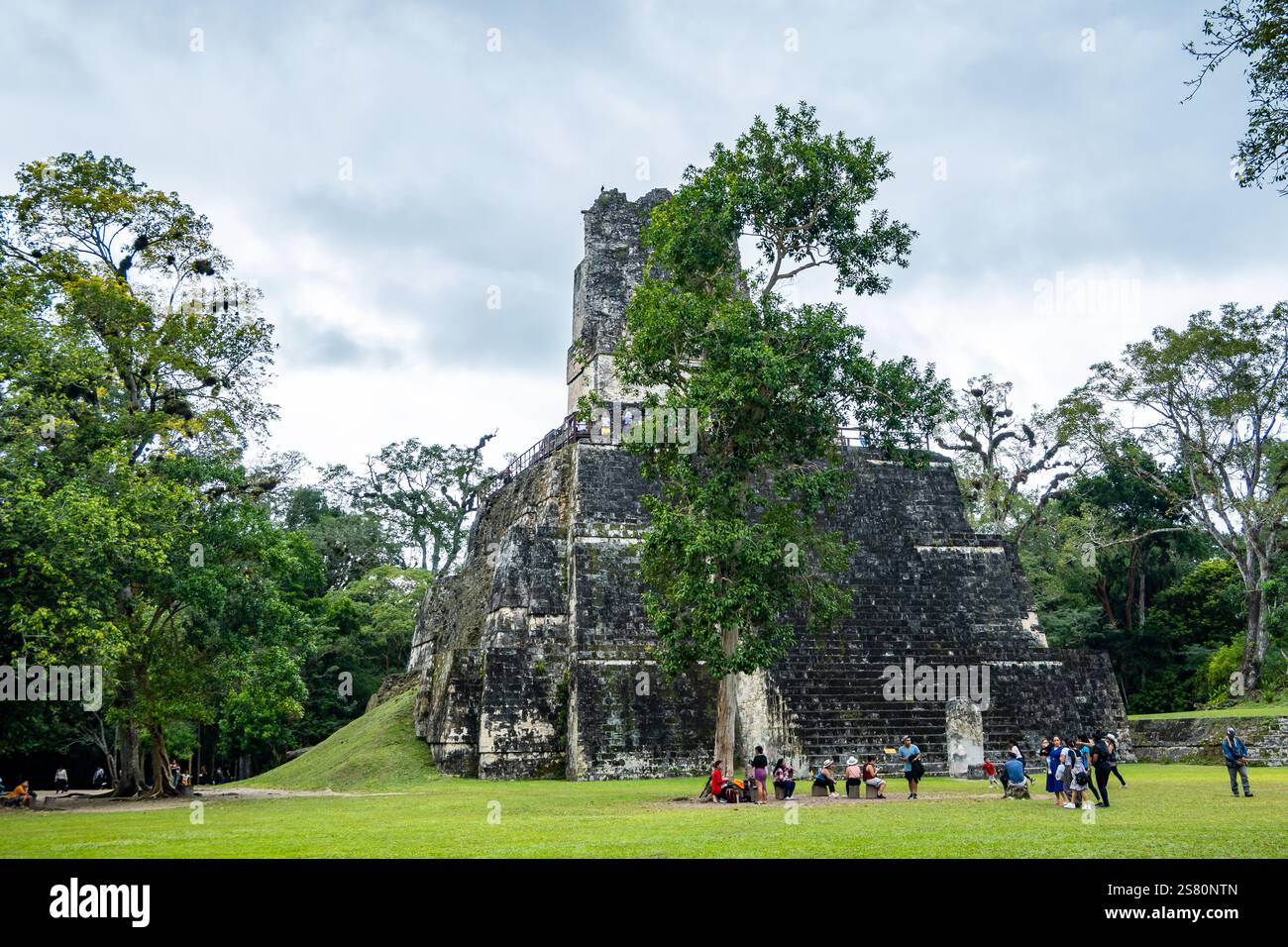 Visitors around Templo II, one of many Mayan temples at Tikal National ...