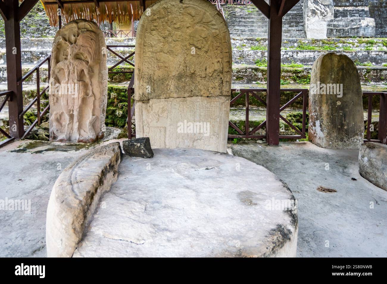 Stone stela with detailed carvings in front of the North Acropolis ...