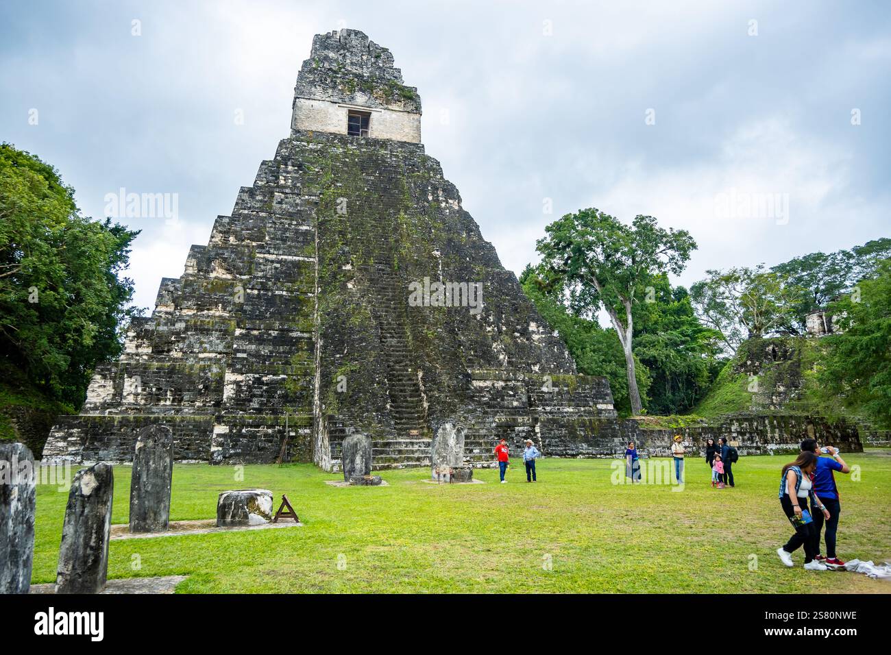 Visitors admire the Templo del Gran Jaguar, one of many Mayan temples ...