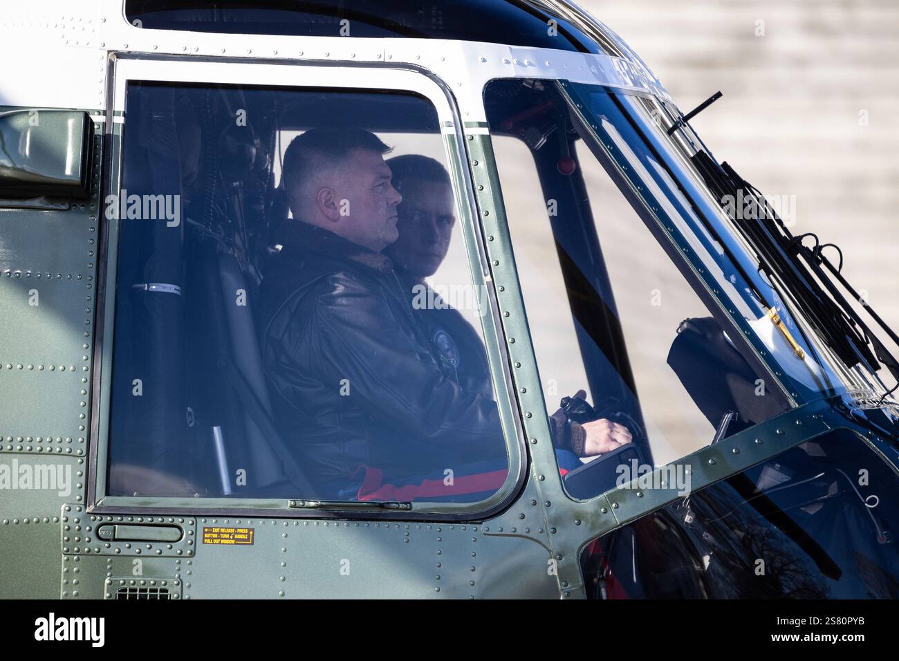 Pilots are seen in the cockpit of Marine One outside the U.S. Capitol ...