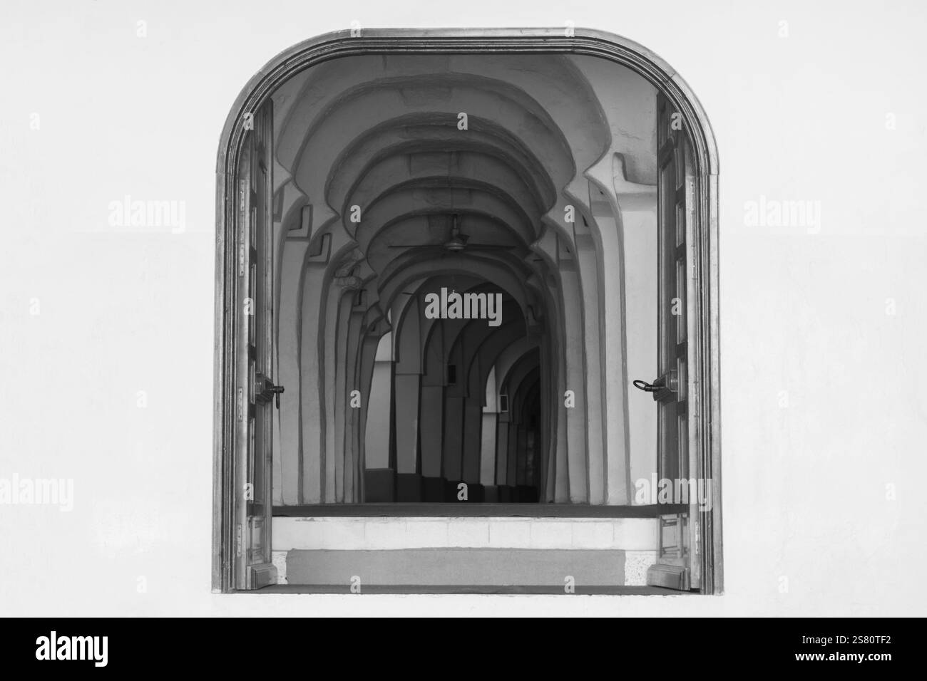 Architectural View Through Arched Doorway Revealing Repeating Arches ...