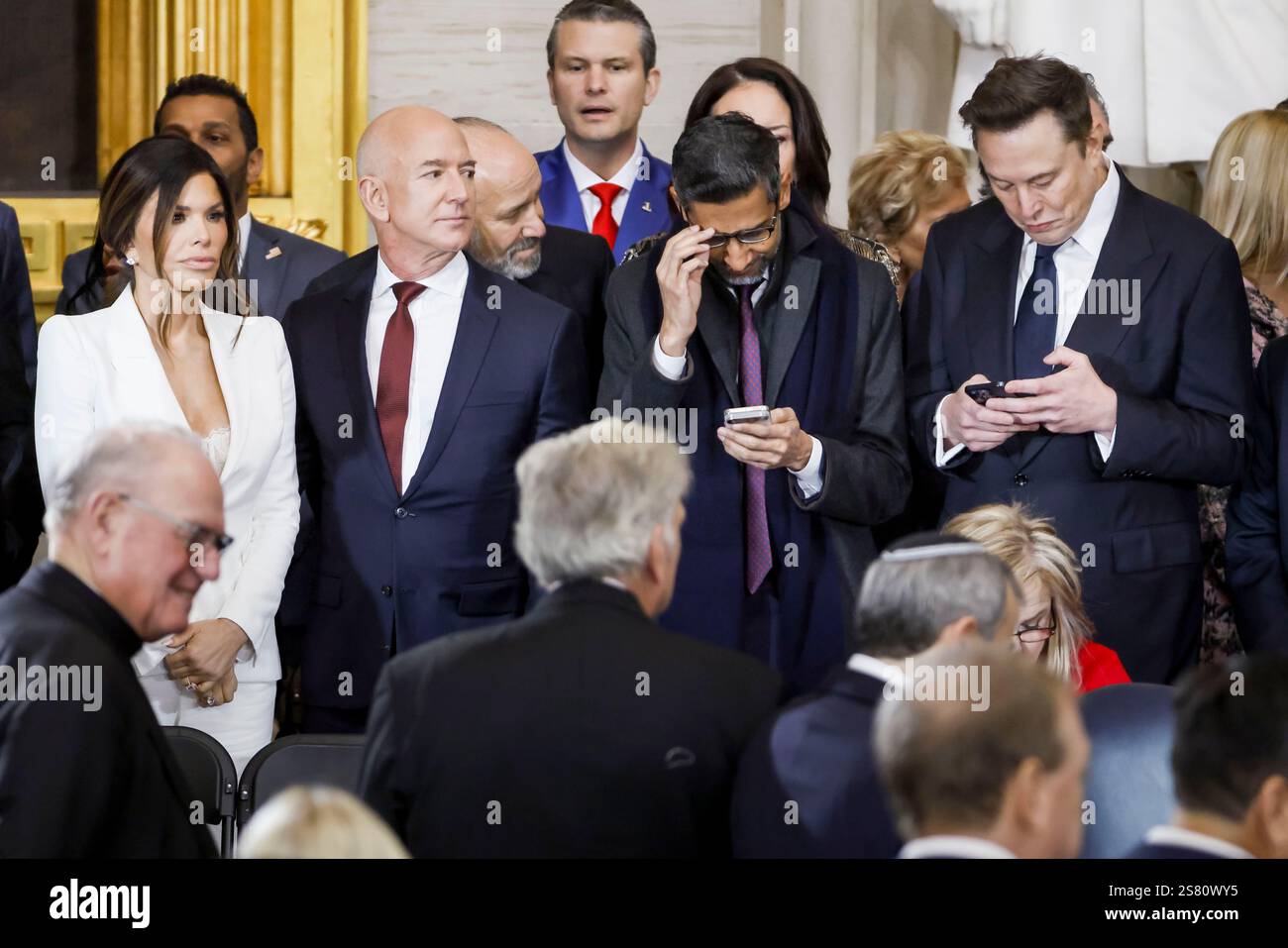 (L-R) Lauren Sanchez, businessman Jeff Bezos, Alphabet’s CEO Sundar ...