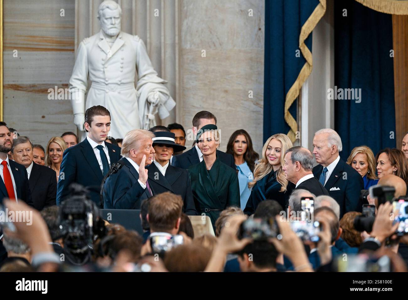 President-elect Donald Trump, center left, takes the oath of office ...