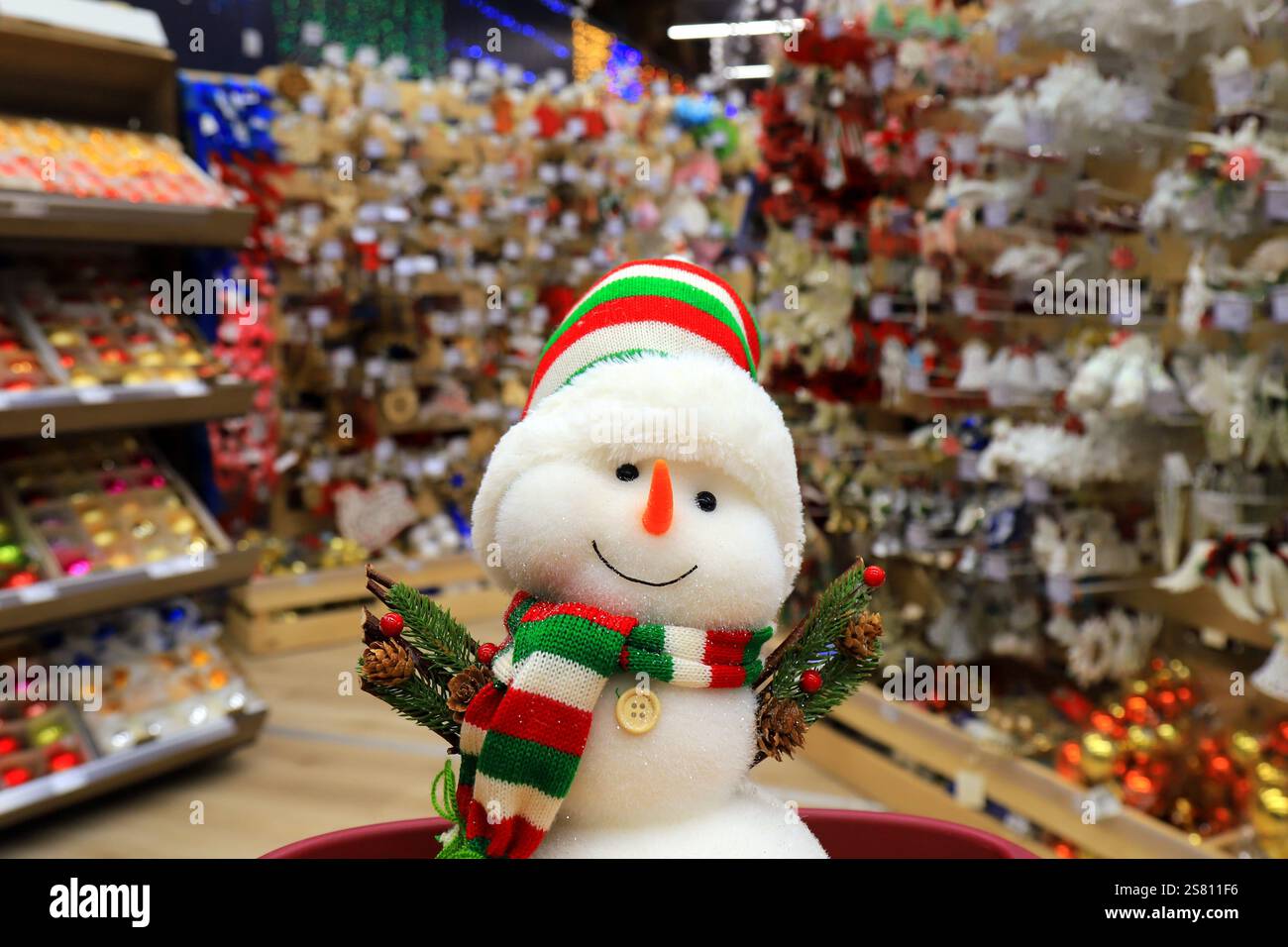 Christmas and New Year toys and decorations. Funny snowmen in hats in ...