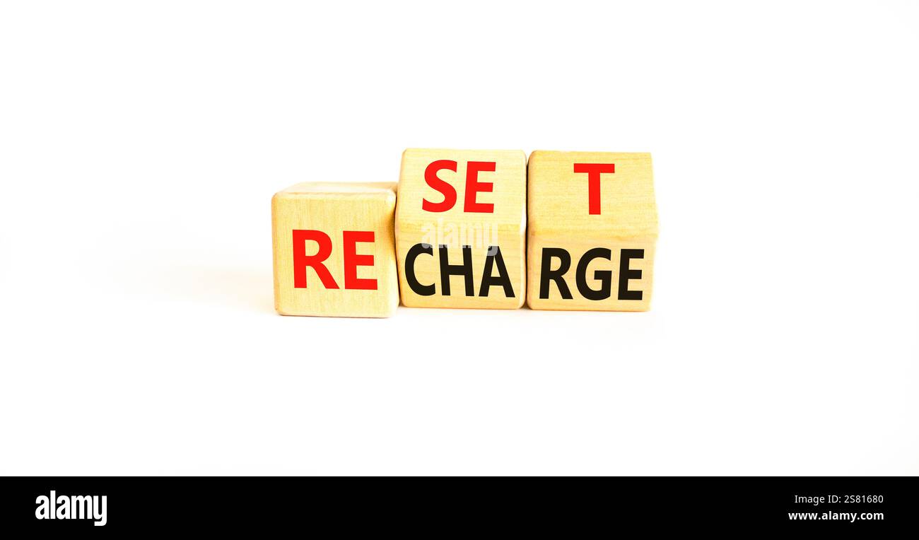 Reset and recharge symbol. Concept words Reset Recharge on beautiful wooden block. Beautiful ...