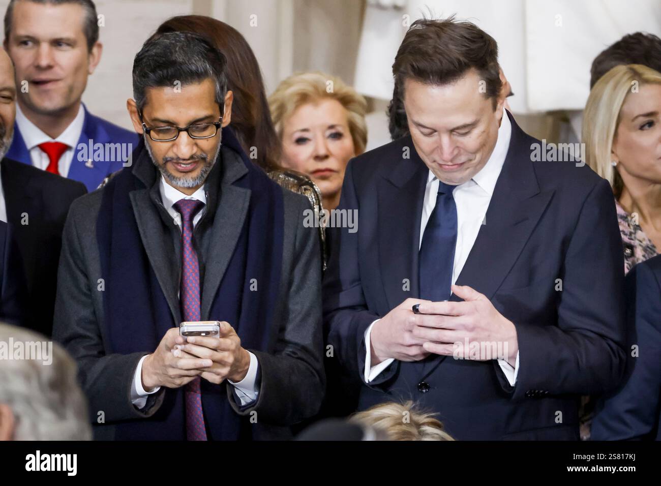 Alphabet’s CEO Sundar Pichai (L) and businessman Elon Musk (R) attend ...