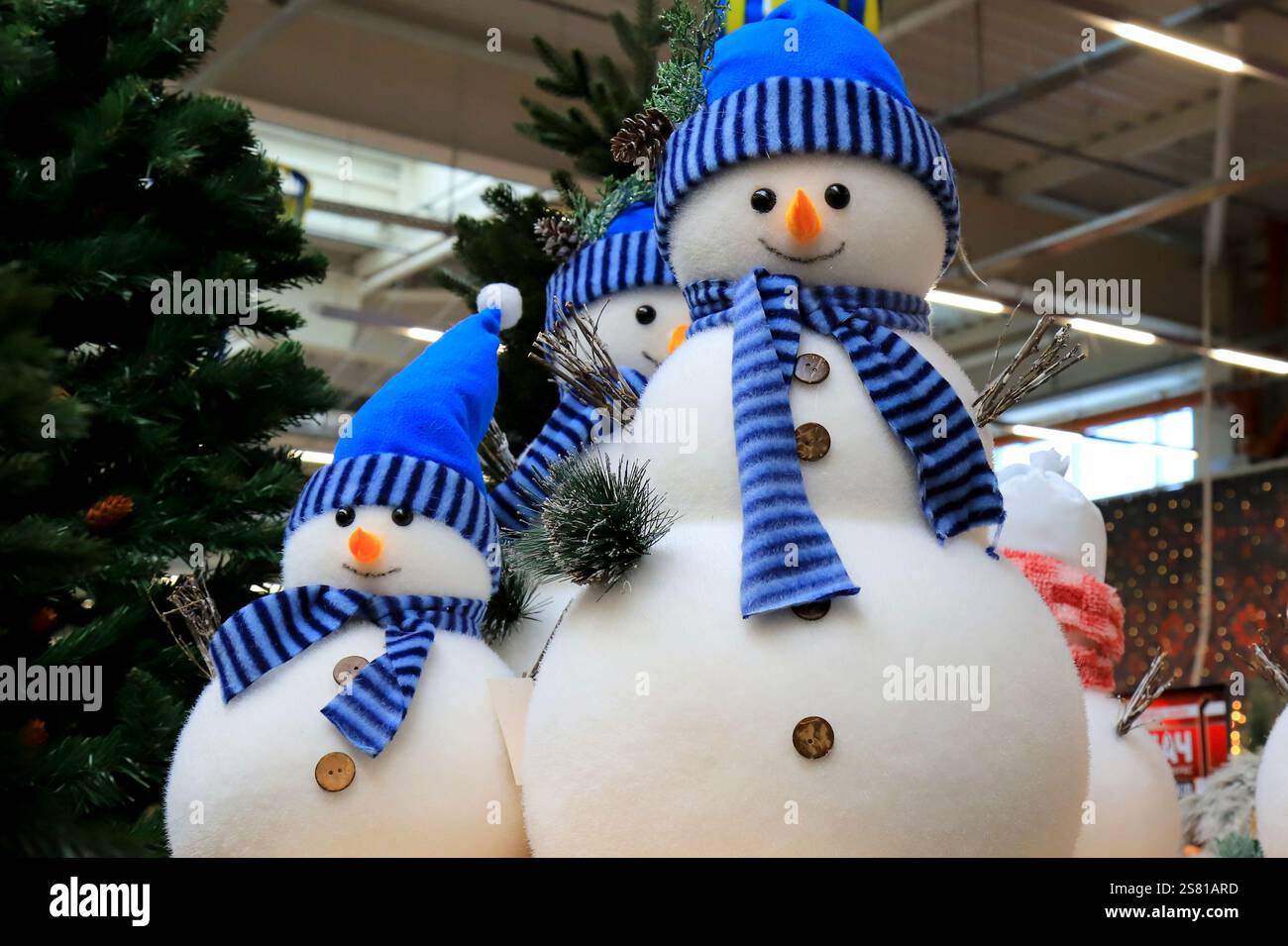 Christmas and New Year toys and decorations. Funny snowmen in hats in ...