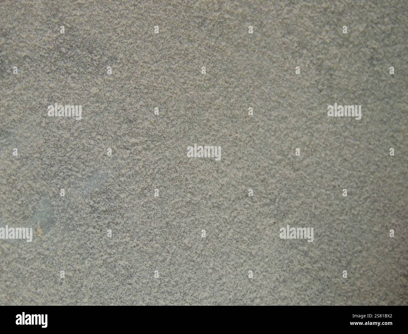 dusty surface close-up full frame, white fluffy dust on dark background ...
