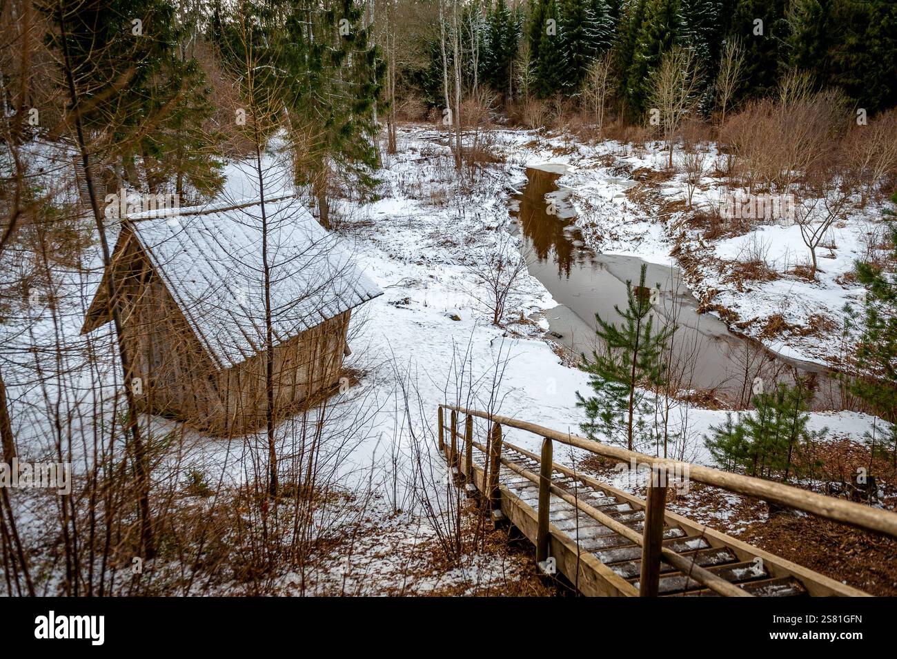Shed for resting on the bank of river. View from the hill and stairs ...
