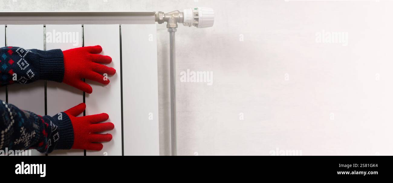 Family warms hands on heater hi-res stock photography and images - Alamy