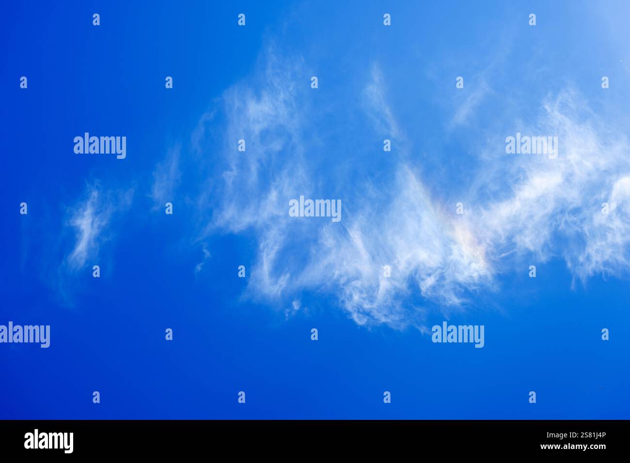 big blue sky with clouds in horizontal position Stock Photo - Alamy