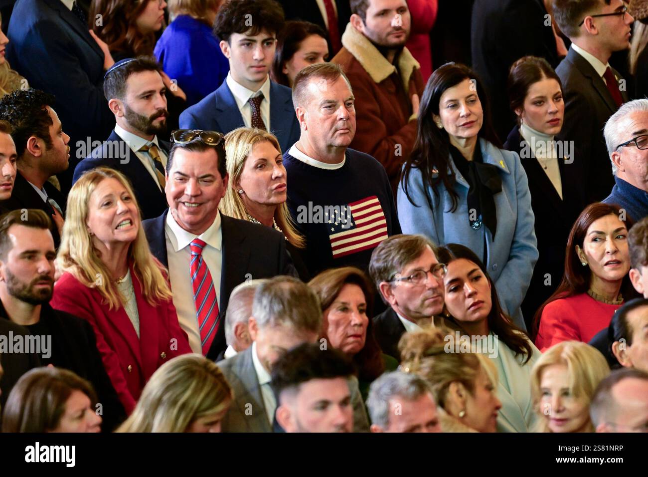 Spectators listen to the national anthem in Emancipation Hall at the ...
