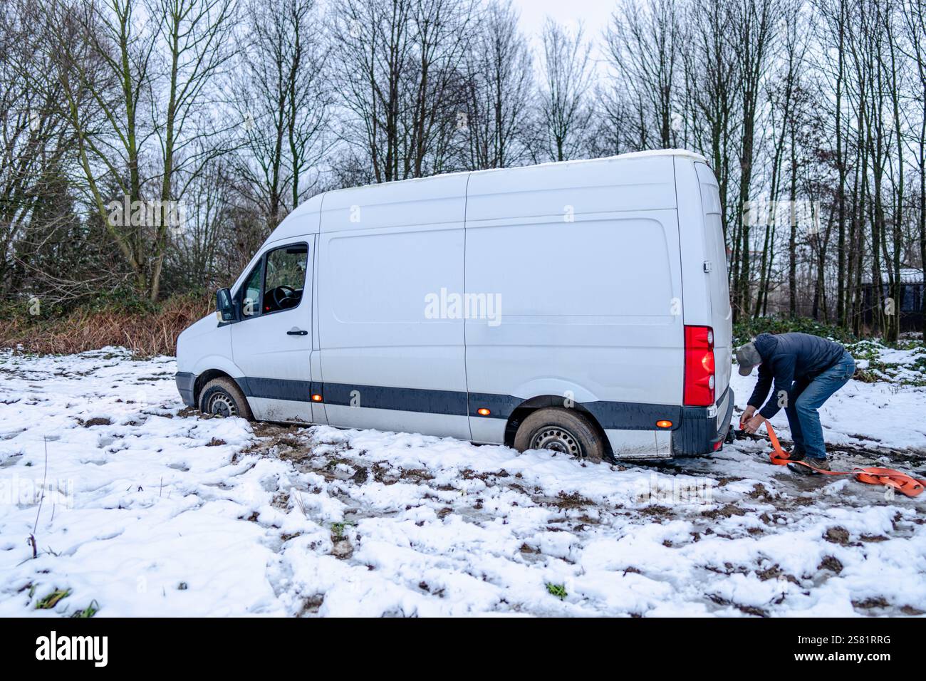 Transporter stuck in snow during winter getting help Stock Photo - Alamy