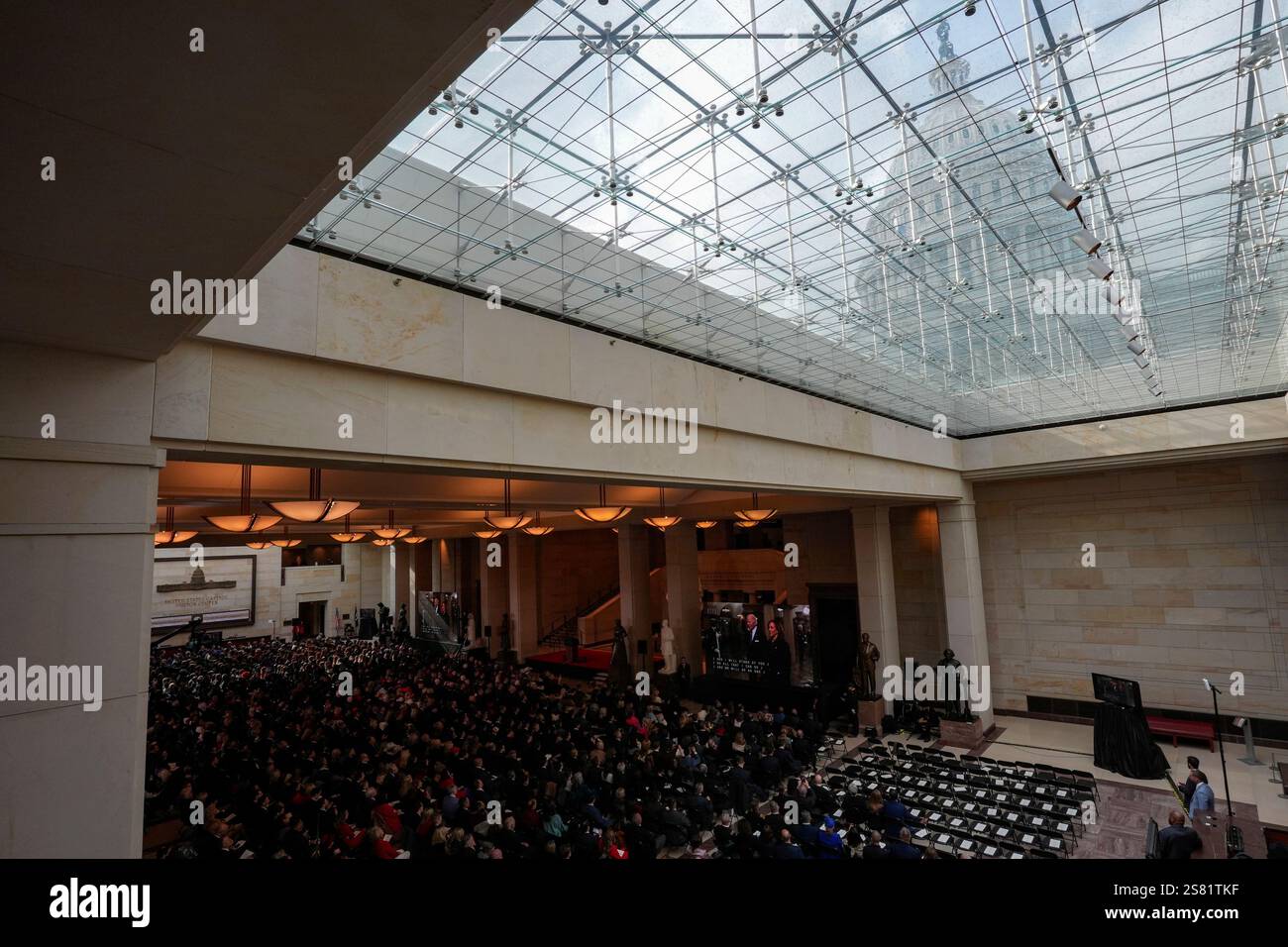 Guests watch from Emancipation Hall during the 60th Presidential ...