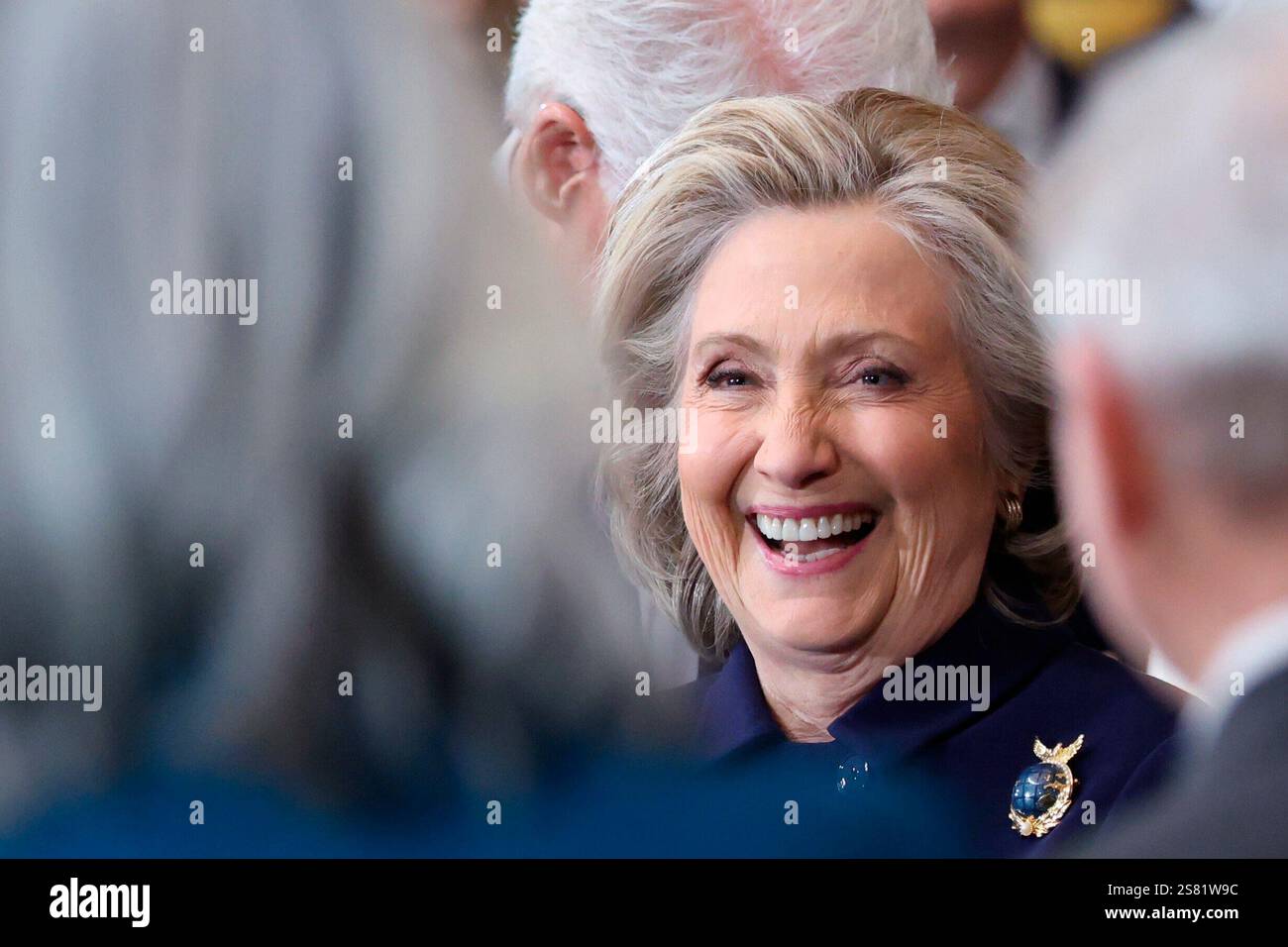 Former Secretary of State Hillary Clinton reacts ahead of the ...