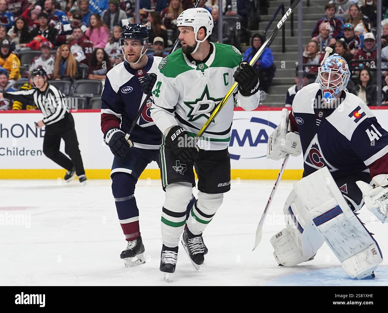 Dallas Stars left wing Jamie Benn (14) moves between Colorado Avalanche ...
