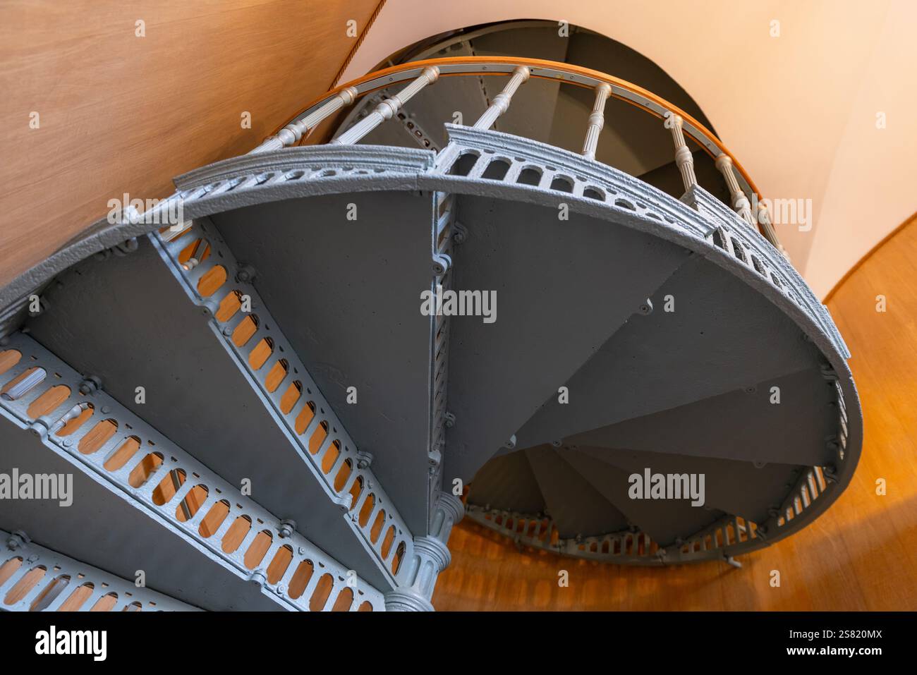 Bottom view of a spiral staircase made of cast iron painted in gray ...