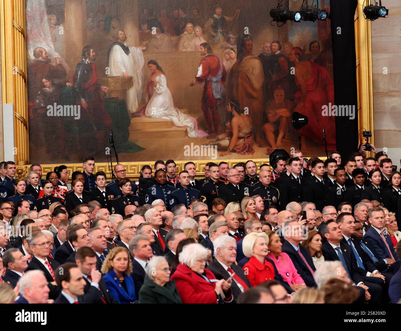 Attendees listen as U.S. President Donald Trump delivers his inaugural ...