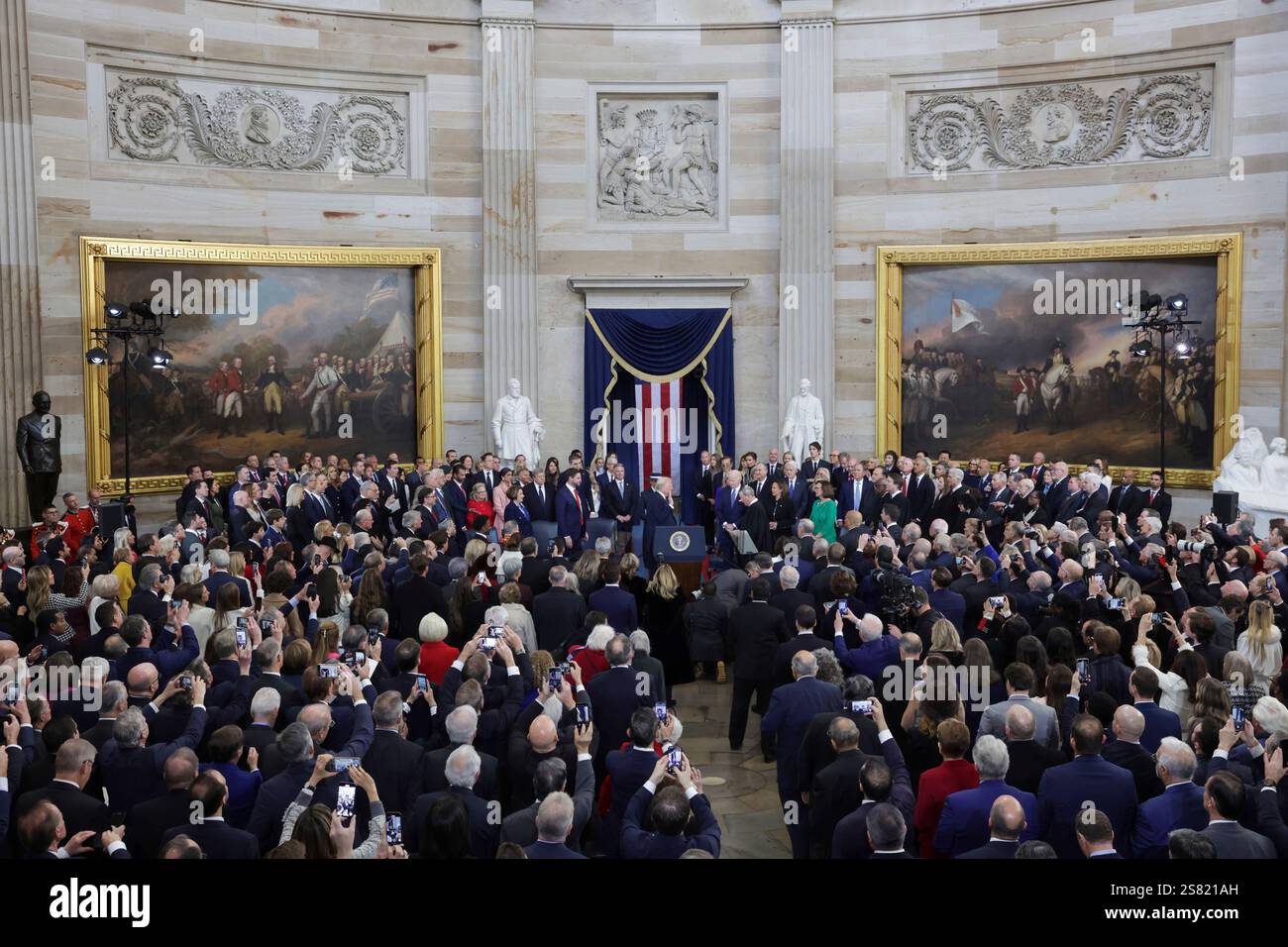 Donald Trump is sworn in during his presidential inauguration in the ...