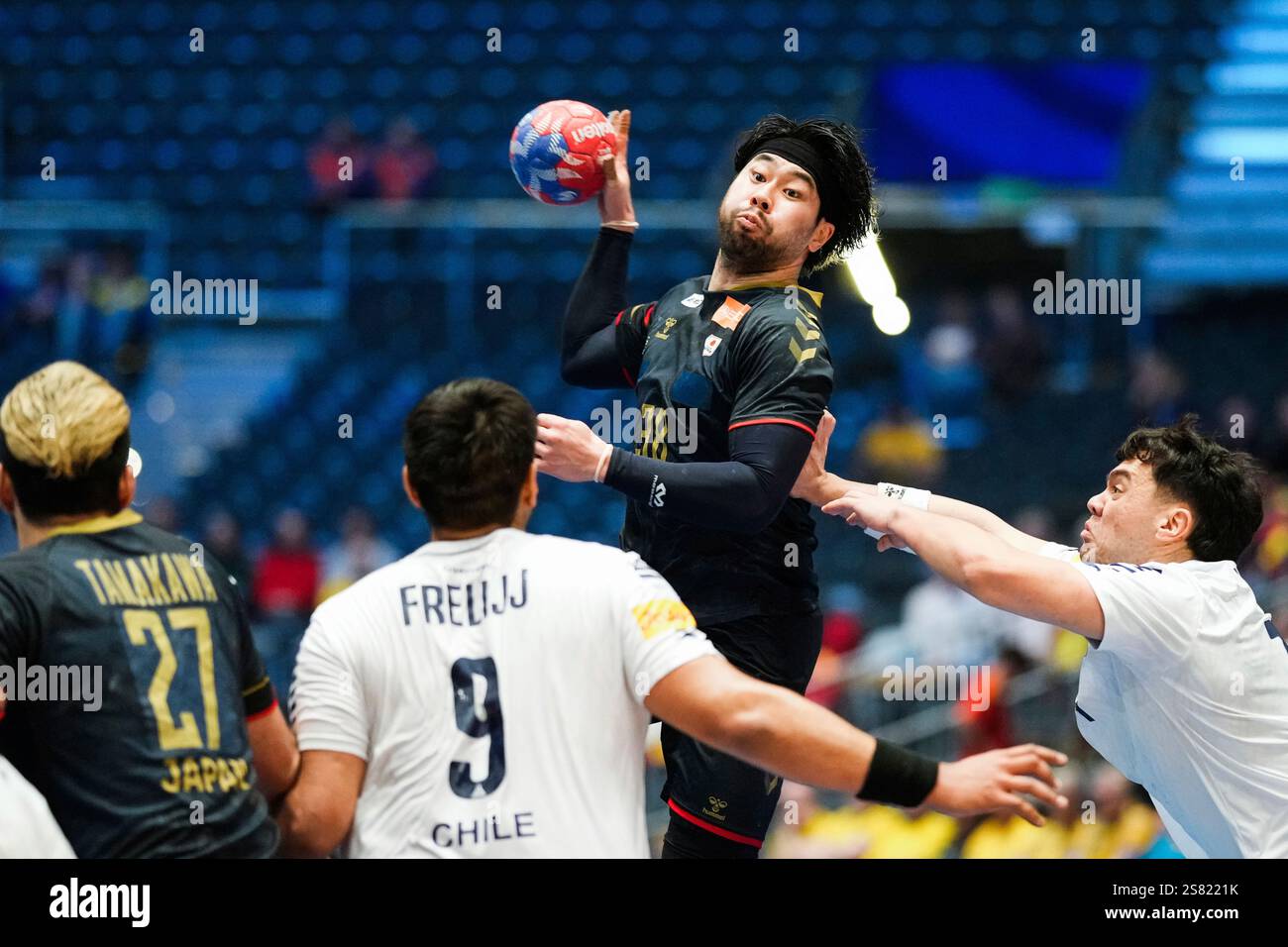 Japan's Mizumachi, top, in action during the World Men's Handball ...