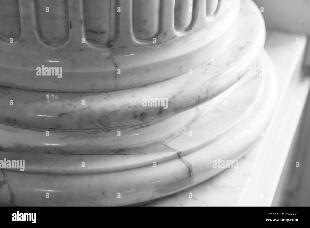 Classic antique interior fragment, round pillar base with white marble ...