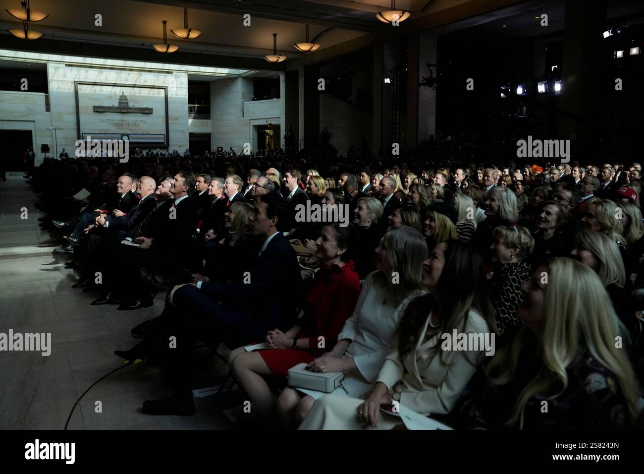 Guests are seen in an overflow room for President-elect Donald Trump's ...