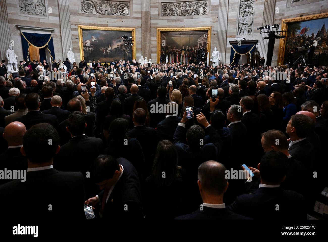 WASHINGTON, DC - JANUARY 20: Attendees sit in the Rotunda during the ...
