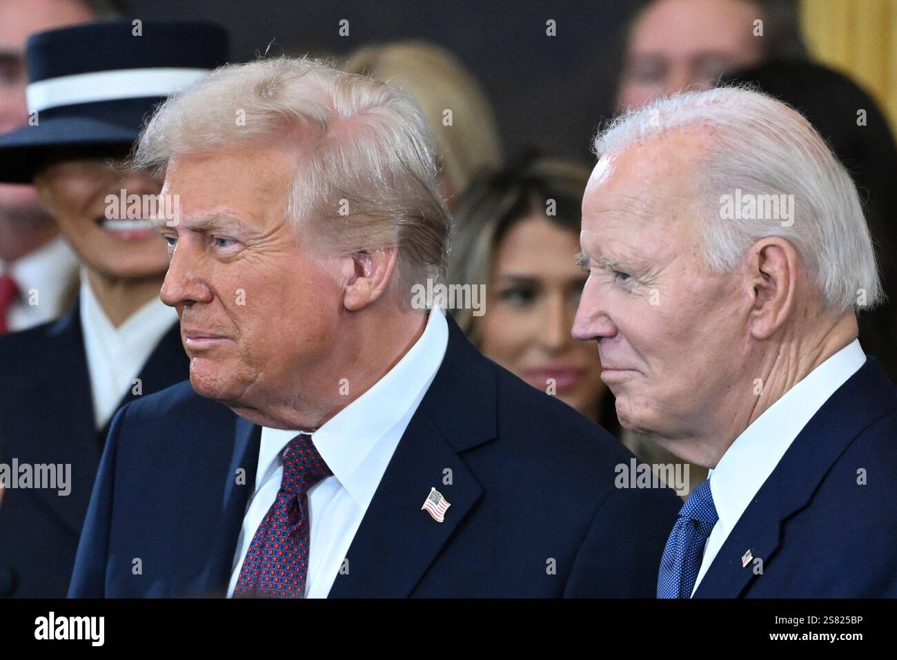 President Joe Biden and President-elect Donald Trump stand together ...