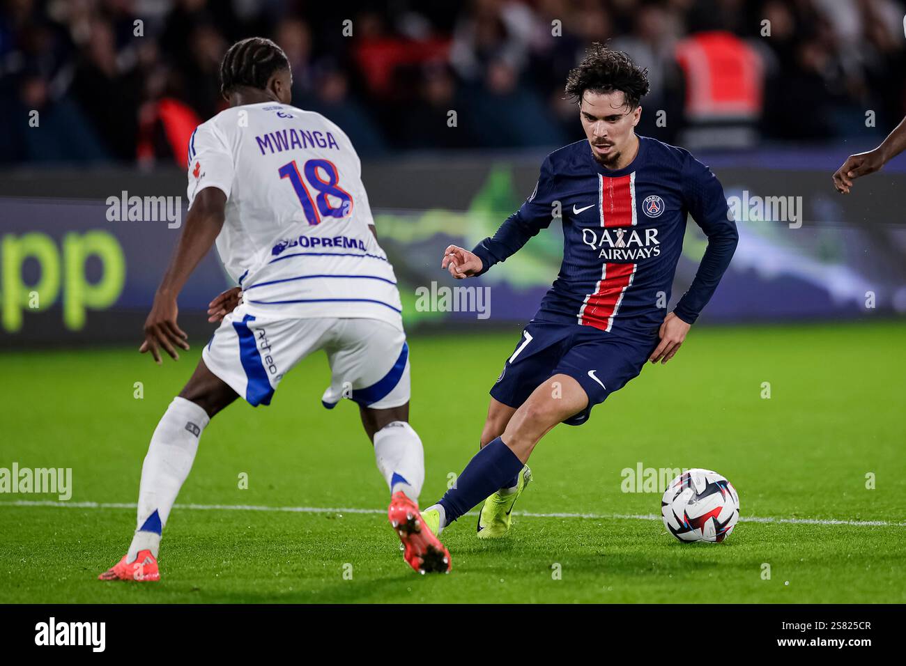 Paris, France. 19th Oct, 2024. Vitor Ferreira of Paris Saint-Germain (R) dribbles Junior Mwanga ...