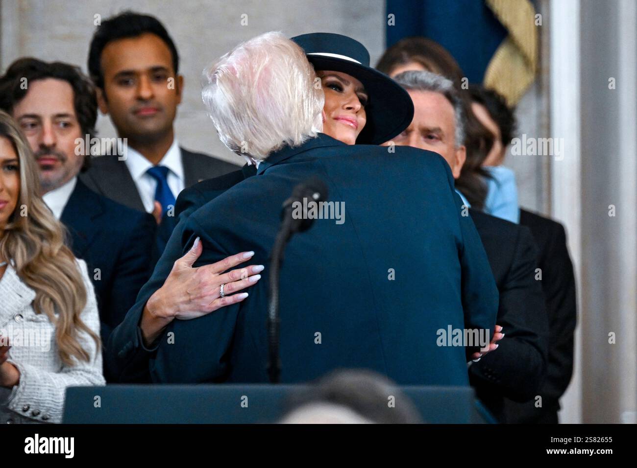 President Donald Trump, left, hugs first lady Melania Trump at the 60th ...