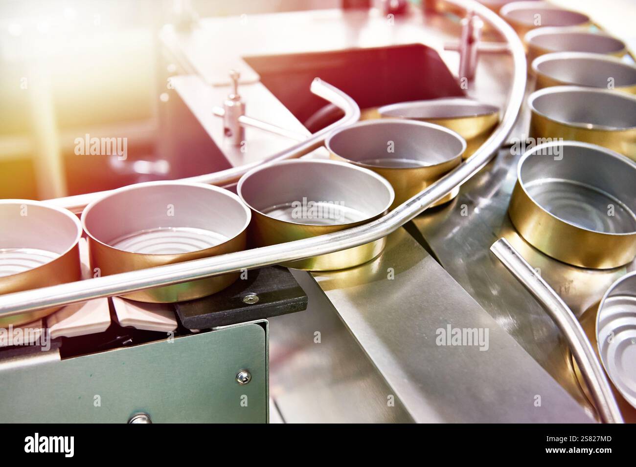 Empty cans on the conveyor of a food factory Stock Photo - Alamy