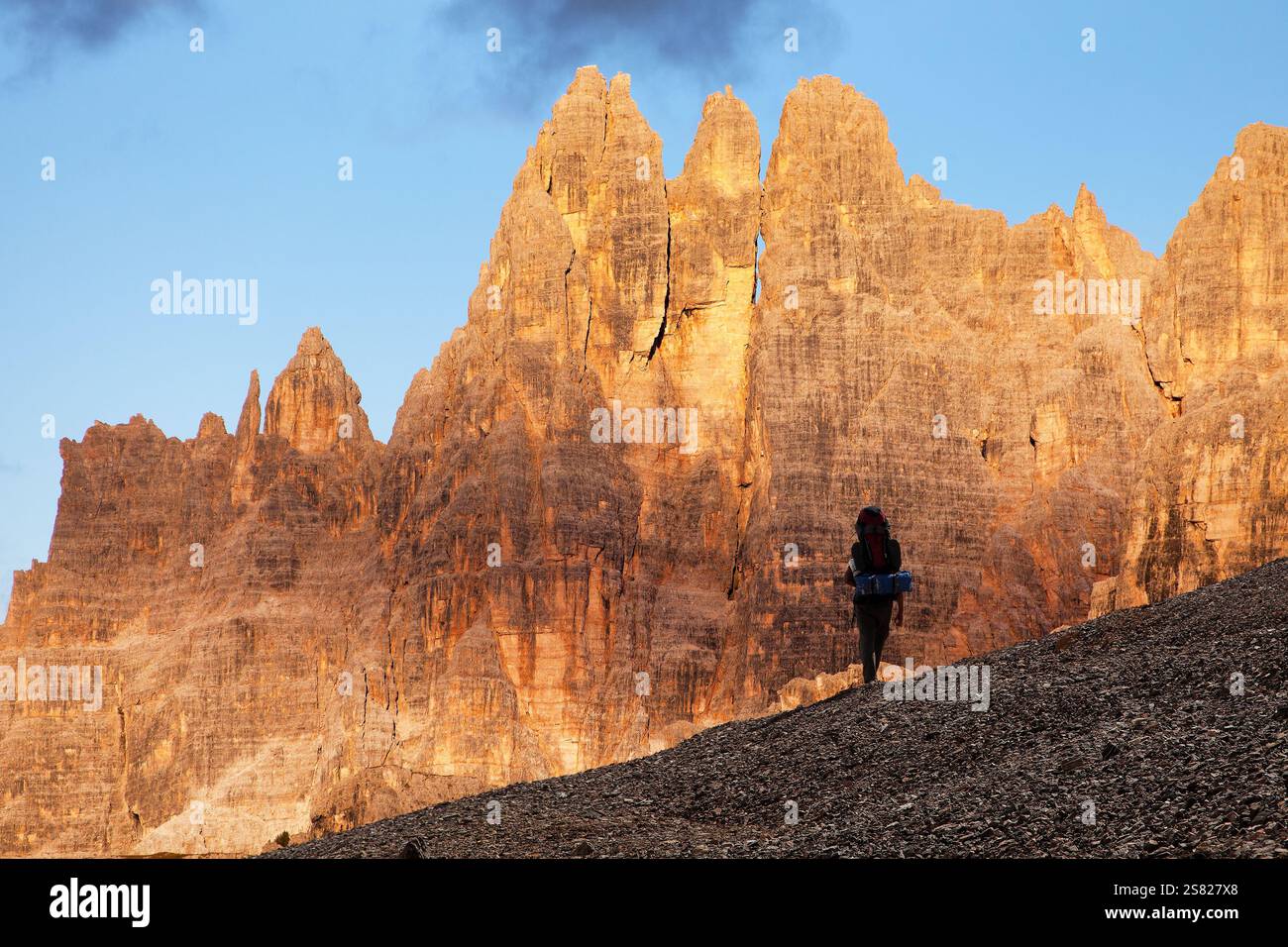 Evening view of mount Croda da Lago from passo Giau and hiker ...