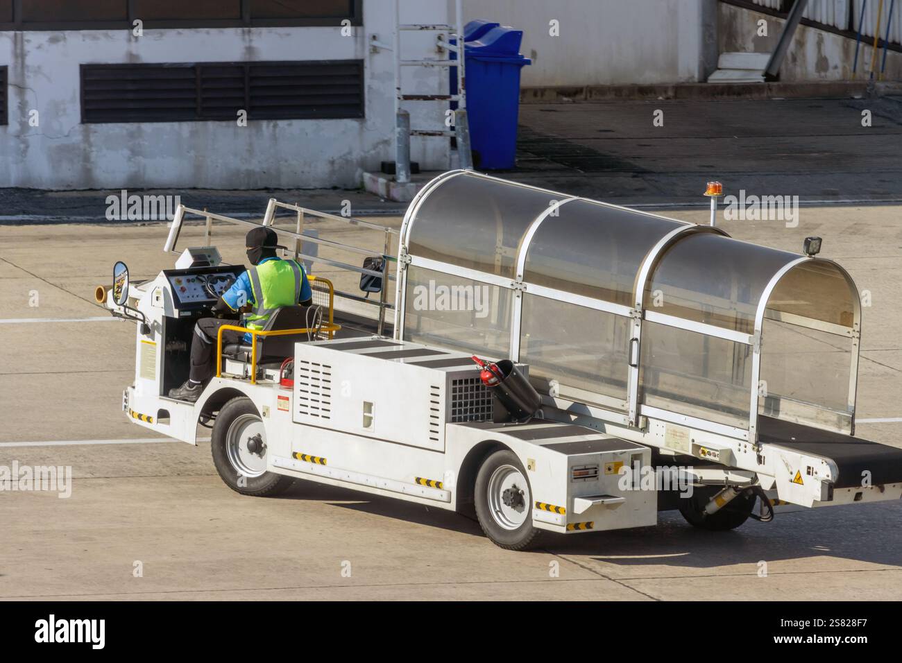 Conveyor Belt Loader driving on a runway Stock Photo - Alamy