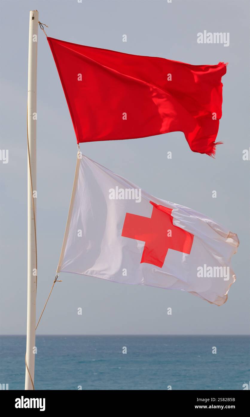 Life guard (cruz roja) flags flying at Piedra Playa beach, El Cotillo ...