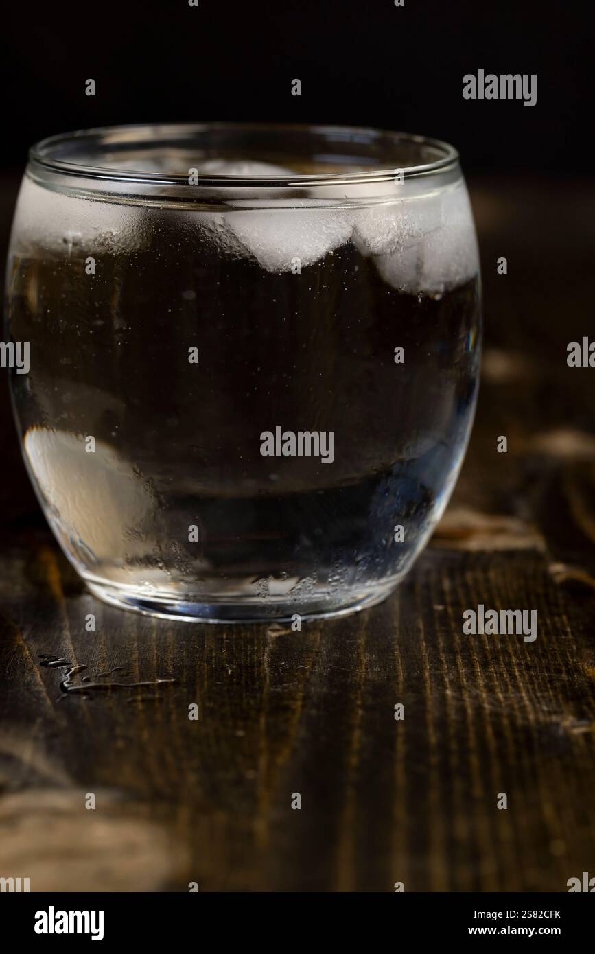 glass with cold sparkling water, cold mineral water with a lot of ...